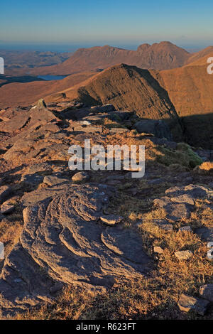 View from the summit of Beinn Alligin over the Torridon Mountains ...