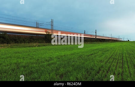 Motion of the modern high-speed train at autumn morning time Stock ...