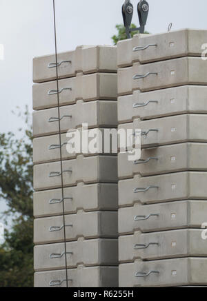 Concrete counterweights on tower crane to balance heavy load being ...