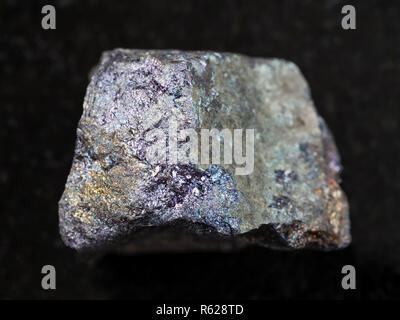 raw bornite stone on dark background Stock Photo - Alamy