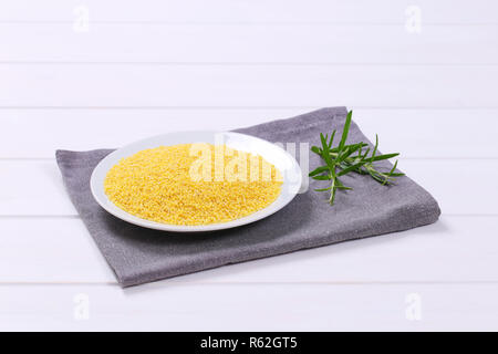 plate of raw millet grains Stock Photo - Alamy
