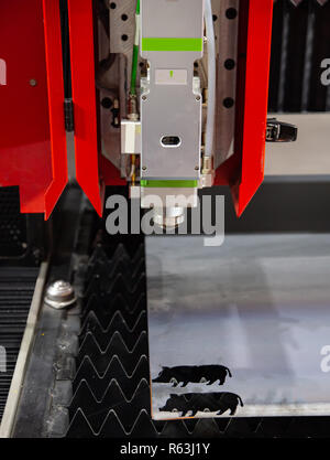 Industrial worker operate CNC fiber laser cutting machine Stock Photo ...