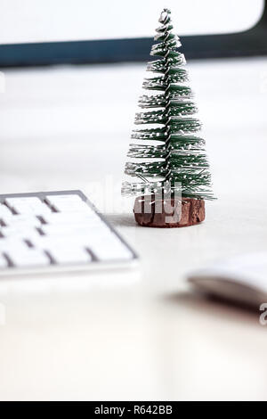 Laptop with Christmas decor at workplace near yellow wall Stock Photo ...