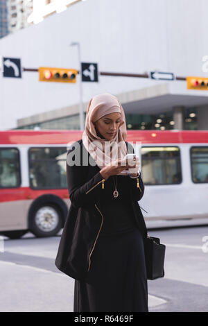 Young woman in bus using cell phone Stock Photo - Alamy