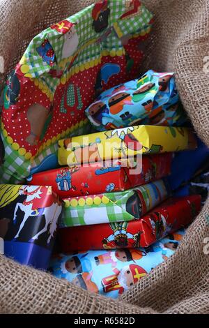 Saint Nicholas with sack full of gifts on light grey background Stock ...