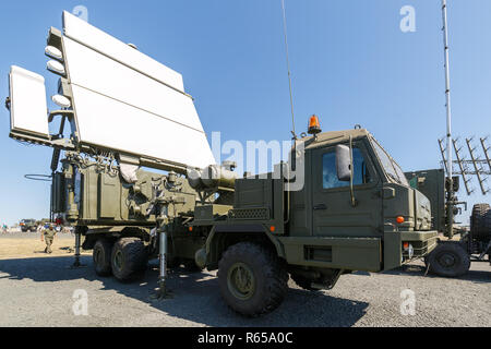 Antenna of modern mobile military radar station on the blue sky ...