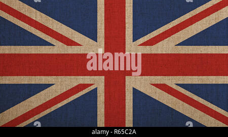 an old stained dirty union jack british flag with dark crumpled edges ...