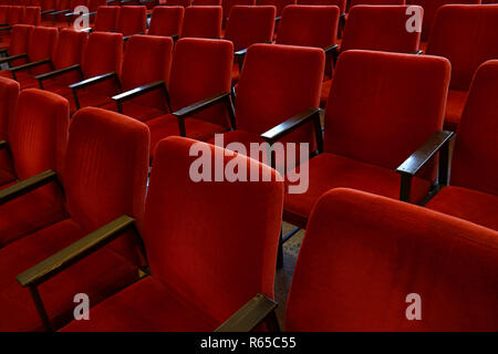 Rows of red soft chair seats close up Stock Photo - Alamy
