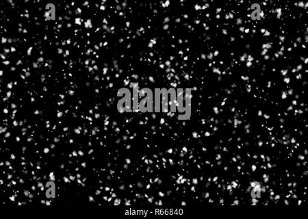 Snow isolated on black overlay Stock Photo - Alamy