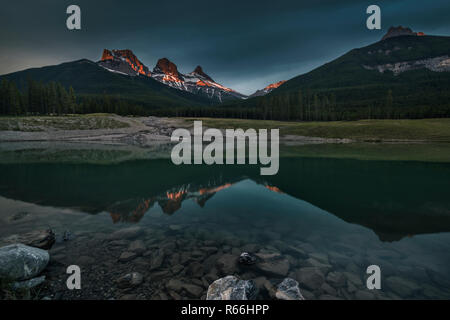 The Three Sisters Mountain Peaks at sunrise, Canmore, Alberta, Canada ...