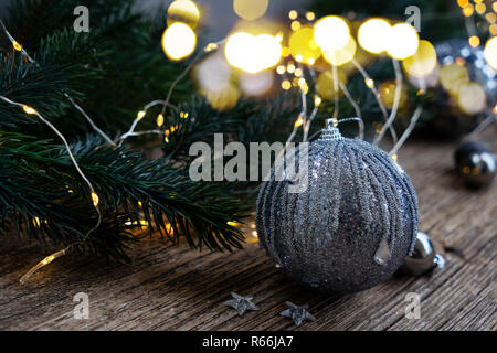 Elegant gray christmas scene with glowing candles on natural wood ...