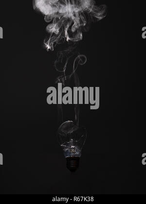 broken light bulb. The bulb exploded and the smoke Comes out of the ...