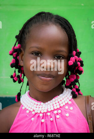 Portrait of a Angolan teenager girl dressed for the church service ...