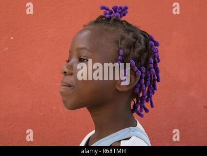 Portrait of a Angolan girl with the typical hairstyle made of braids ...