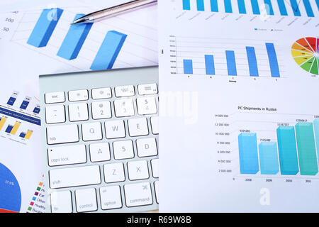 Picture of bar graph paper, pen and keyboard Stock Photo - Alamy