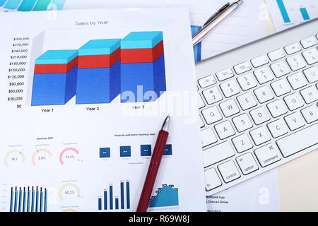 Portrait of graph paper, two pen and keyboard Stock Photo - Alamy