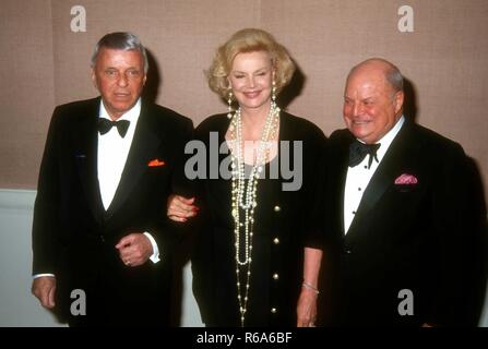 Comedian Don Rickles and his wife Barbara Rickles carry their son ...