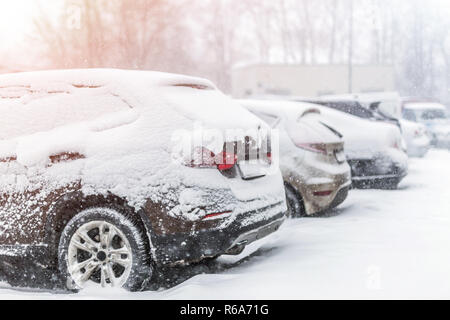 The car, covered with snow.Heavy snowfall, precipitation. The problem ...