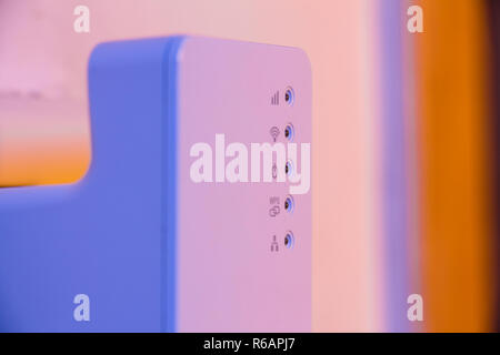 Closeup on WiFi repeater signal connection status led lights. The ...