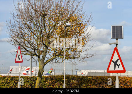 Road sign. Warning, aircraft on the way Stock Photo - Alamy