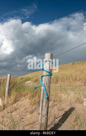 pole knotted with long rope Stock Photo - Alamy
