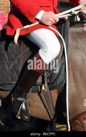 Huntsman ready for the hunt red coats whip Stock Photo - Alamy