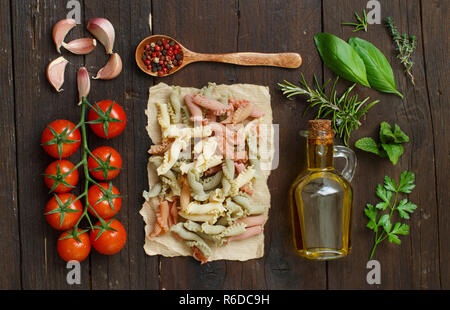 Tricolor pasta, vegetables, herbs and olive oil Stock Photo - Alamy