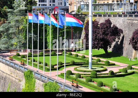 Luxembourg national flag in the Park at the place de la Constitution ...