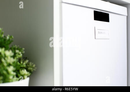 White cardboard box with business sign Stock Photo - Alamy