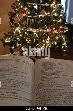 Open Bible in front of Christ Cross, candles, Evangelical St. John's ...