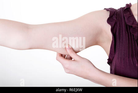 hand pinching in upper arm Stock Photo - Alamy