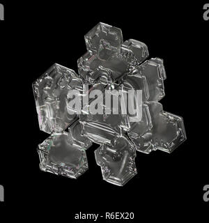 Extreme magnification - Real snowflake isolated on black background ...