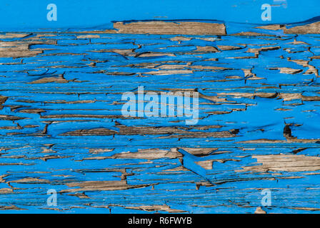Old blue paint splitting on wood Stock Photo - Alamy