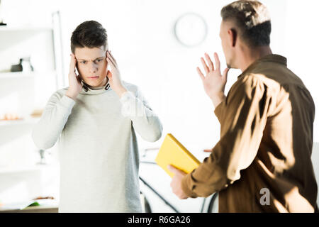 irritated father yelling at teen son in car Stock Photo - Alamy