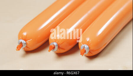 Snack Sausage with plastic wrapping Stock Photo - Alamy