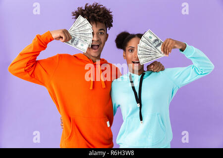 Photo of attractive lucky afro woman wear green turtleneck rising fist ...