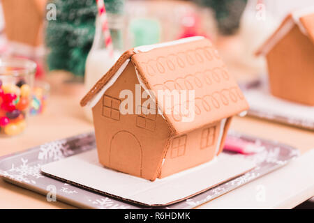Close up of gingerbread houses at kids craft Christmas party Stock ...
