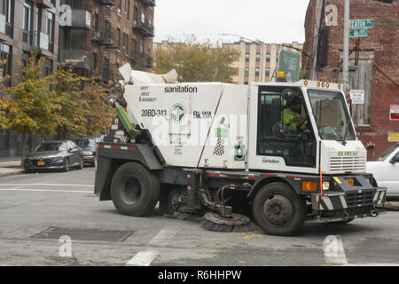 New York City sanitation truck worker emptying street bins new york ...