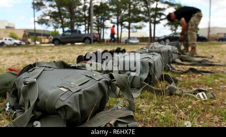 U.S. Army jumpmaster prepares a paratrooper to jump out of a MH-60 ...