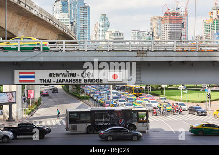 Thai-Japan Friendship Bridge with city skyline in the background and ...