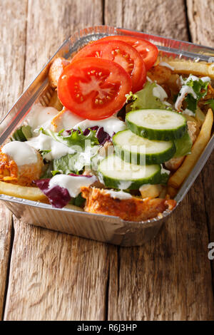 Kapsalon Dutch food item consisting of fries, topped with doner or ...