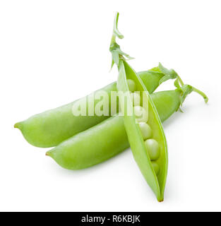 Green pea pods on white plate with wooden chopsticks on black mat in ...