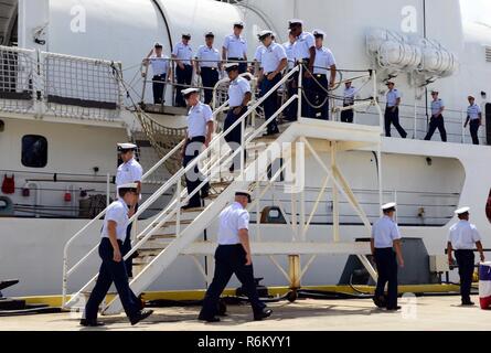 Crewmembers disembark the Hamilton-class cutter WHEC-722 during a ...