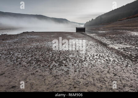 Low water levels at Ladybower reservoir revealing the old remains of ...