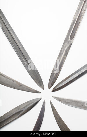 Collection of knife or dagger blades and swords arranged in pointing ...