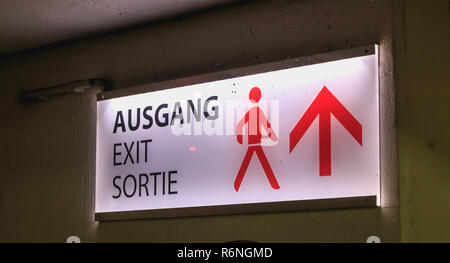 Emergency exit sign in a parking garage Stock Photo - Alamy