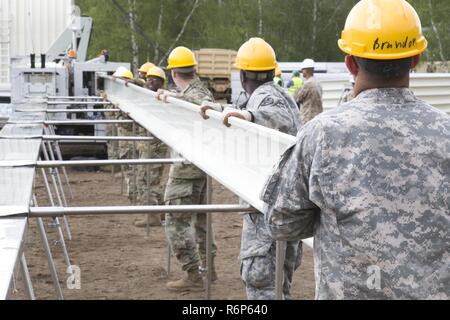 Soldiers from the 902nd Engineer Company (Vertical), 15th Engineer ...