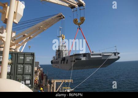 Improved Navy Lighterage System (INLS) Warping Tug 11 hip tows the INLS ...