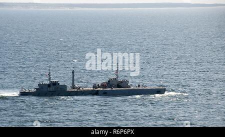 Improved Navy Lighterage System (INLS) Warping Tug 11 hip tows the INLS ...