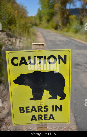 Bear warning sign on the trail at Cave and Basin National Historic Site ...